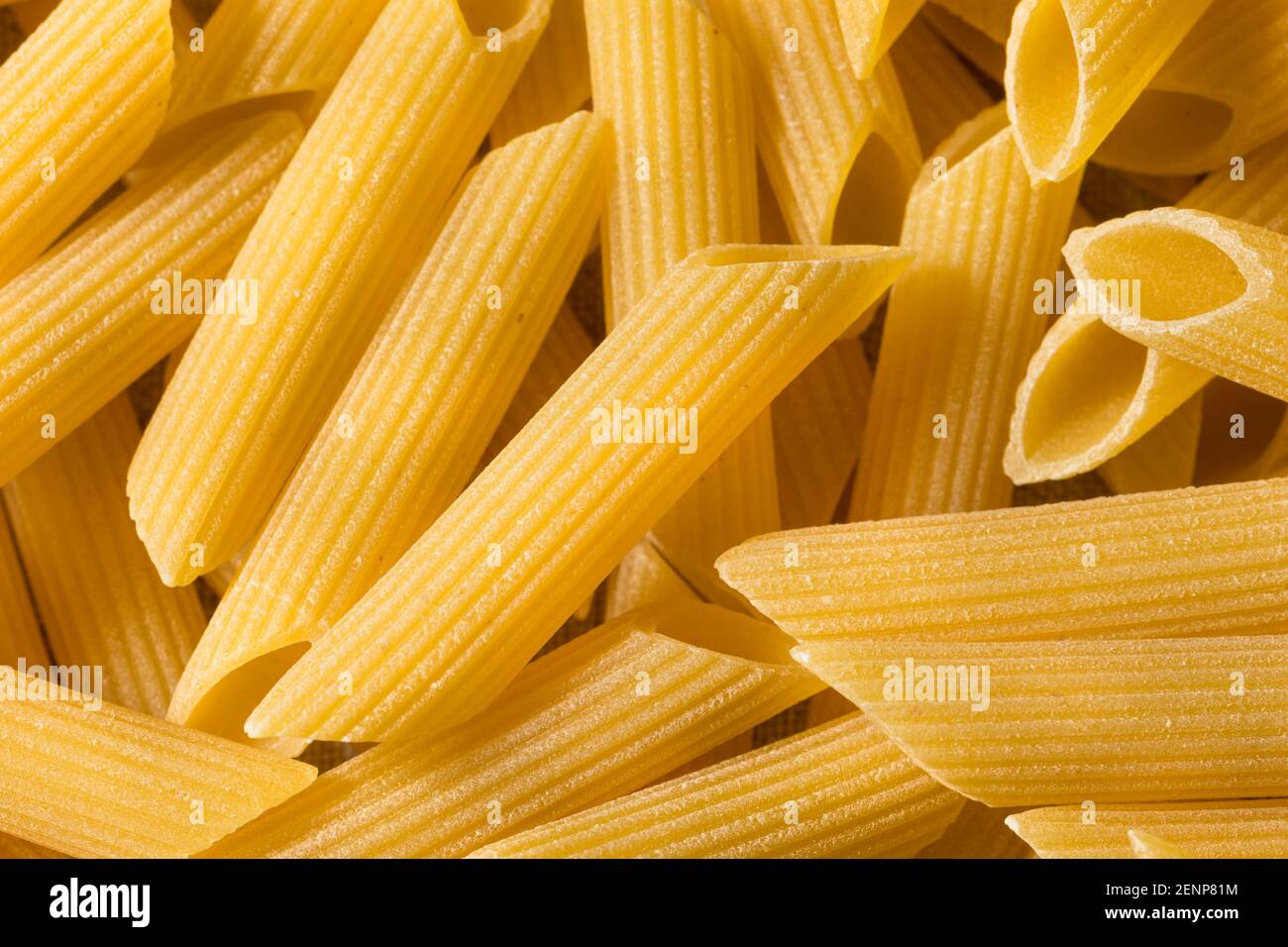 Raw Organic Dry Penne Pasta Ready to Cook Stock Photo - Alamy