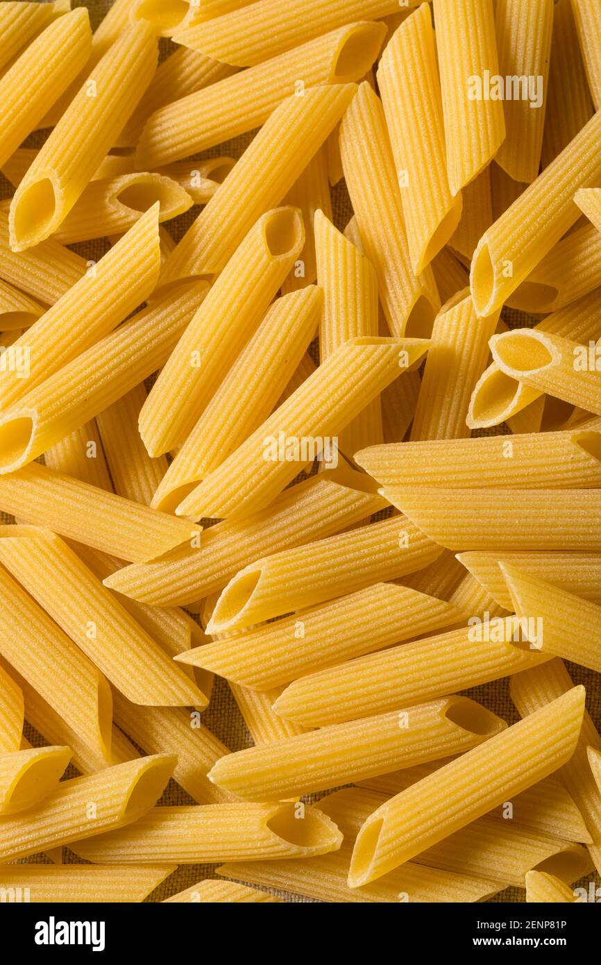 Raw Organic Dry Penne Pasta Ready to Cook Stock Photo - Alamy