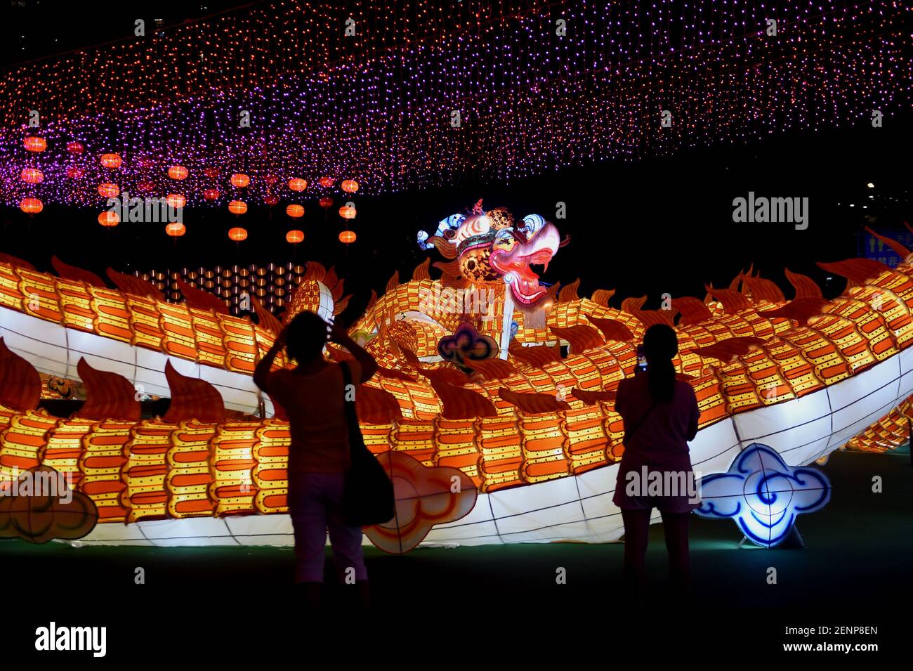 People take pictures of the laterns at the Latern Festival in the ...