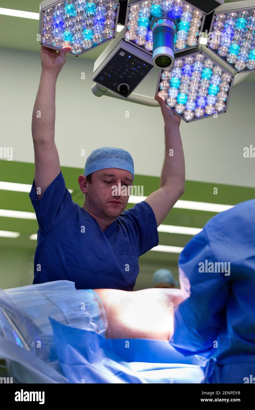 Doctors & Surgeons perform operation Stock Photo - Alamy