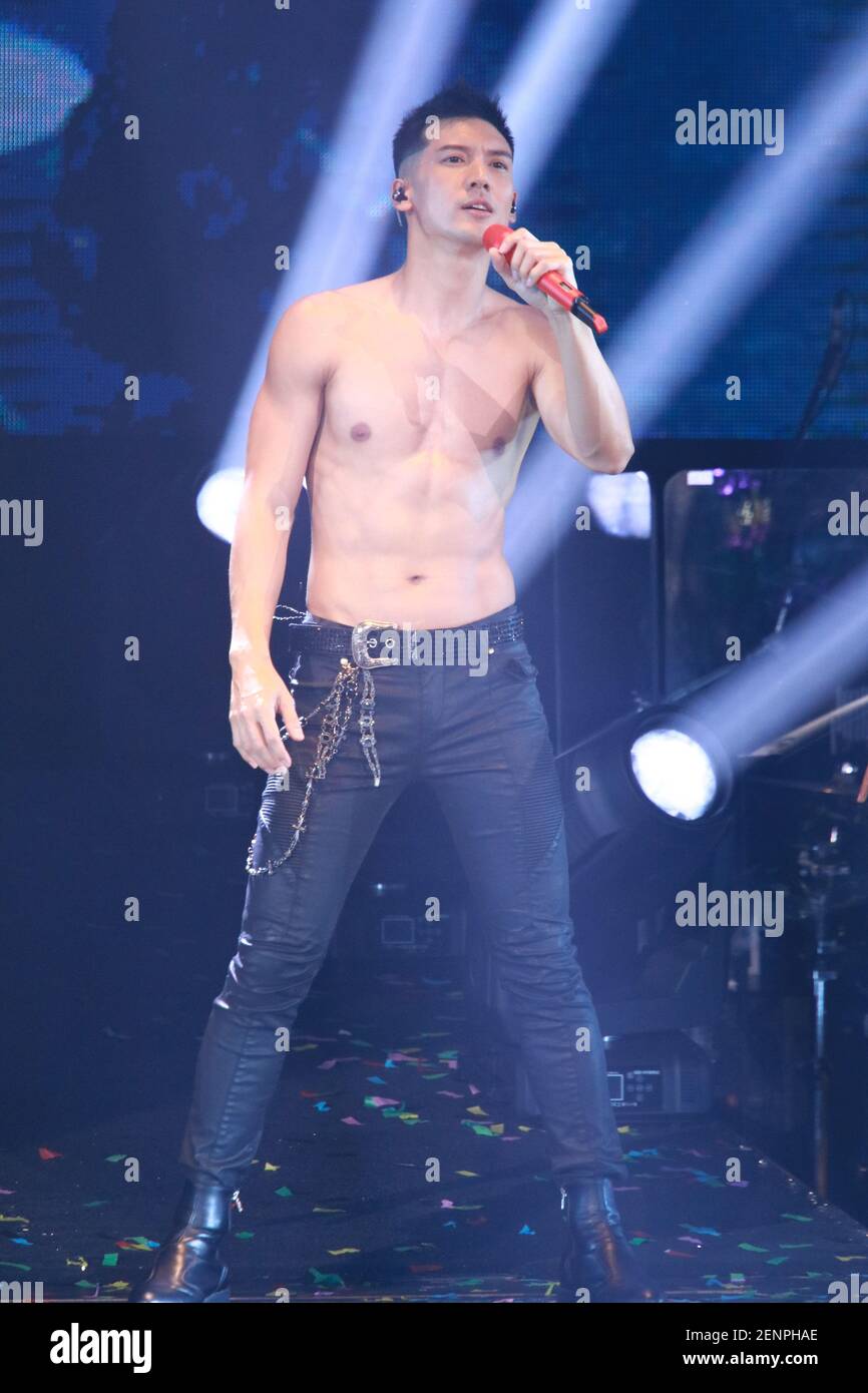 Hong Kong singer-songwriter and actor Kenny Kwan sings at his concert ...