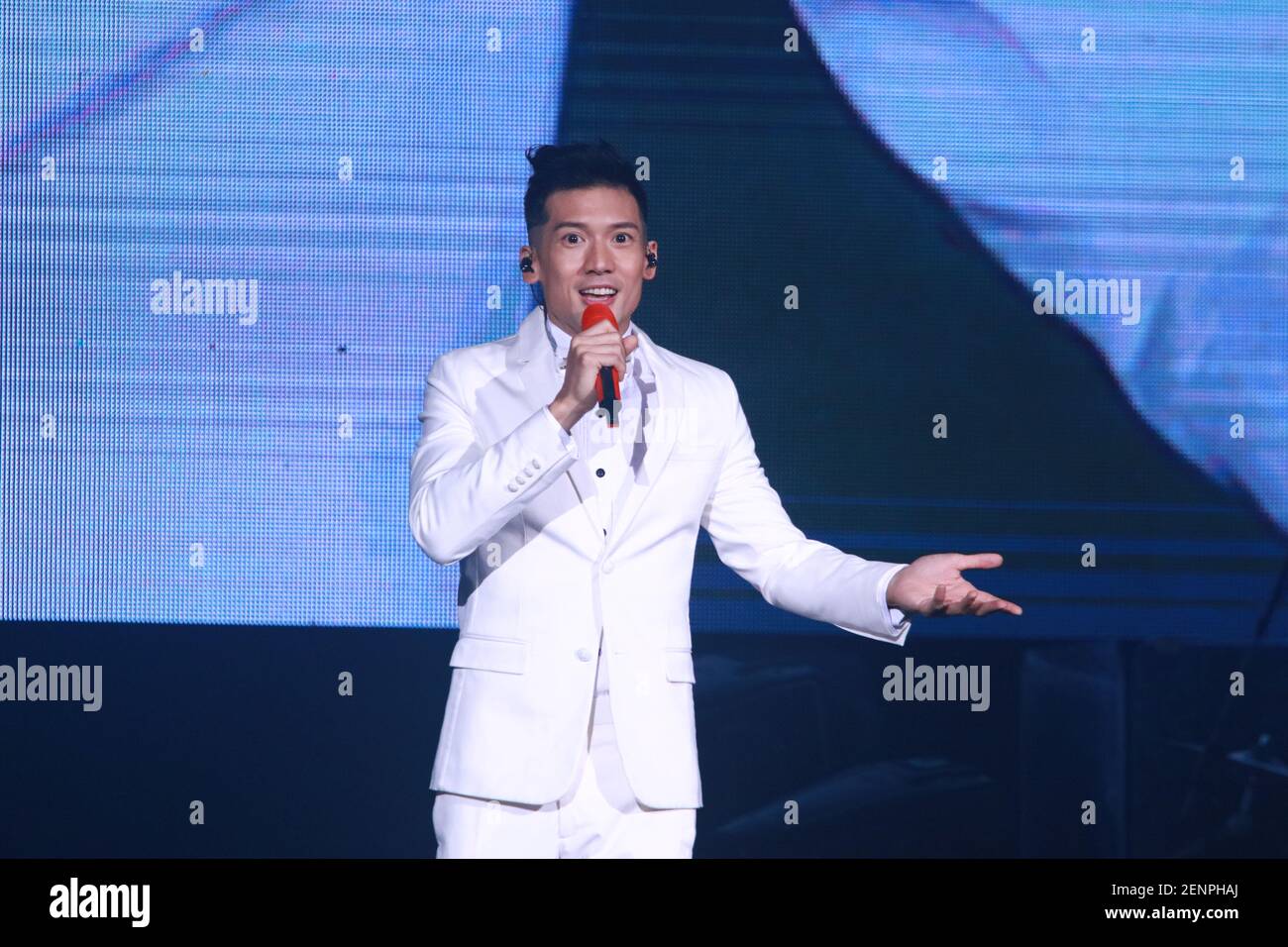 Hong Kong singer-songwriter and actor Kenny Kwan sings at his concert ...