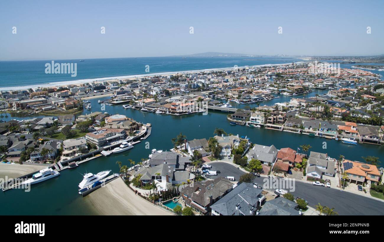 Aerial view of a neighborhood nestled inside a harbor, next to the ...