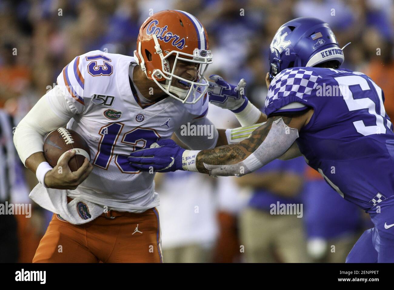 September 14, 2019: Florida Gators QB Felipe Franks (13) fights off a ...