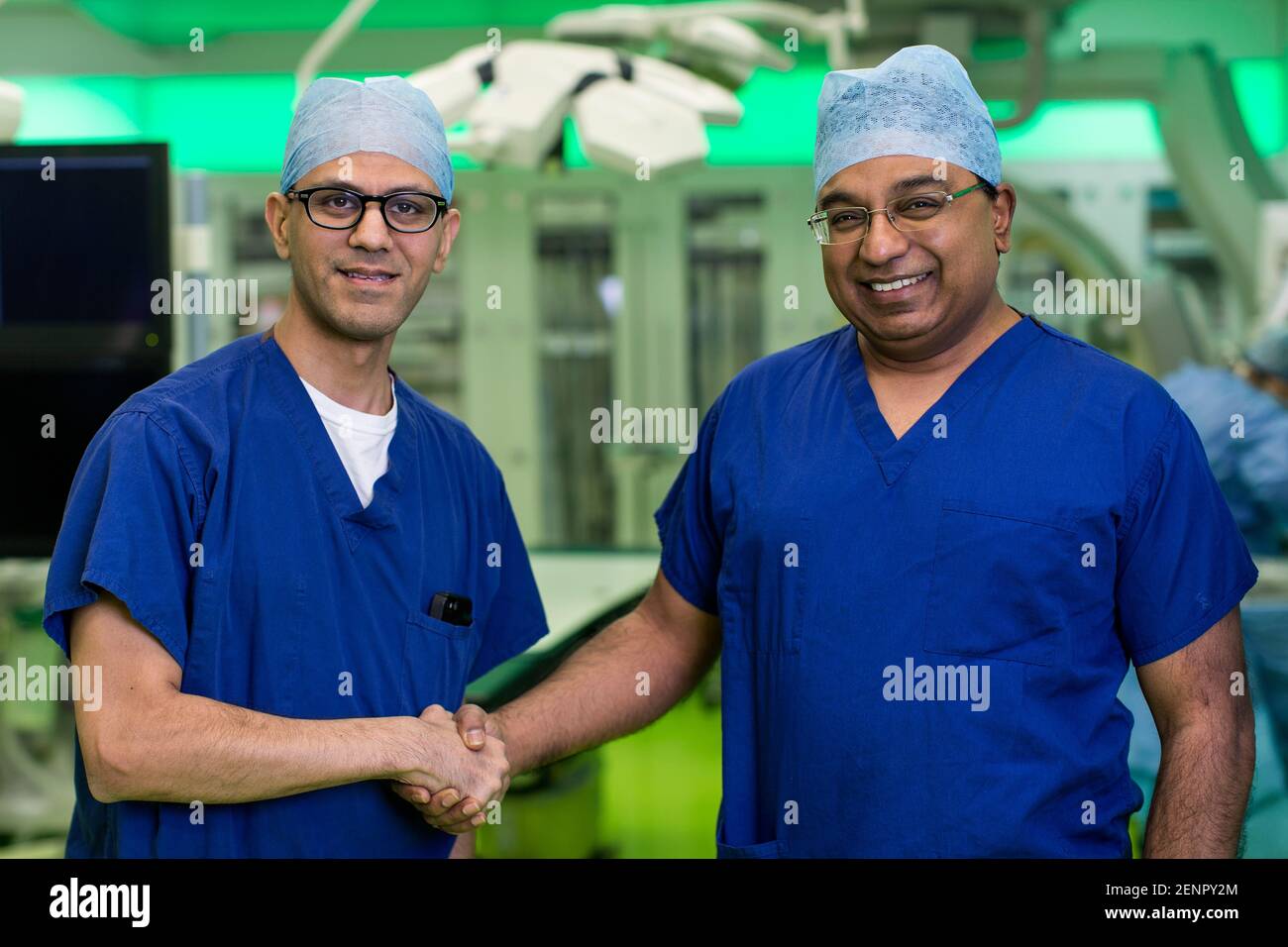 Doctors & Surgeons perform operation Stock Photo - Alamy
