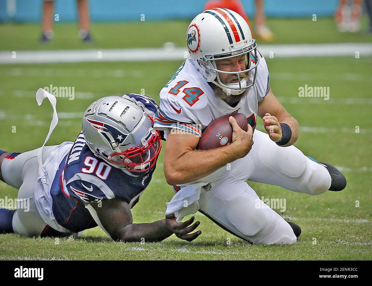 Miami Dolphins quarterback Ryan Fitzpatrick (14) is sacked by New ...