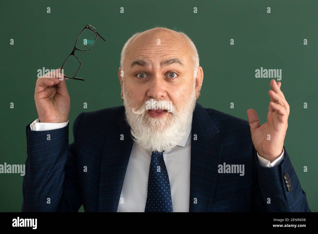 Closeup face of excited professor or surprised teacher on blackboard ...