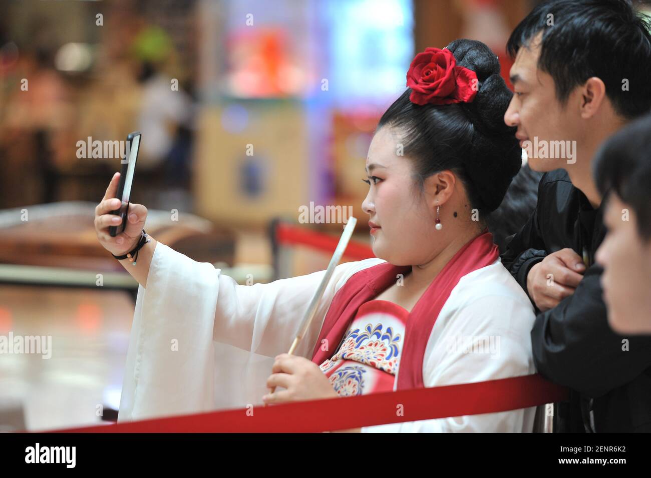 Beauties dressing in ancient Chinese clothes prepare to demonstrate and ...