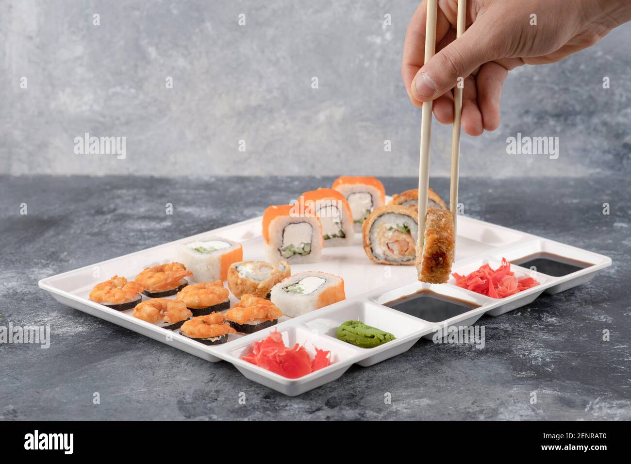Sushi eating dinner chopsticks hi-res stock photography and images - Alamy