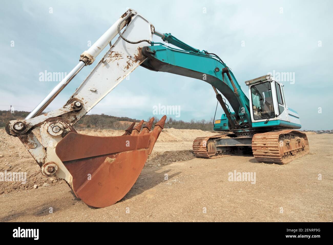 Excavator on road construction site. Wide angle view Stock Photo - Alamy