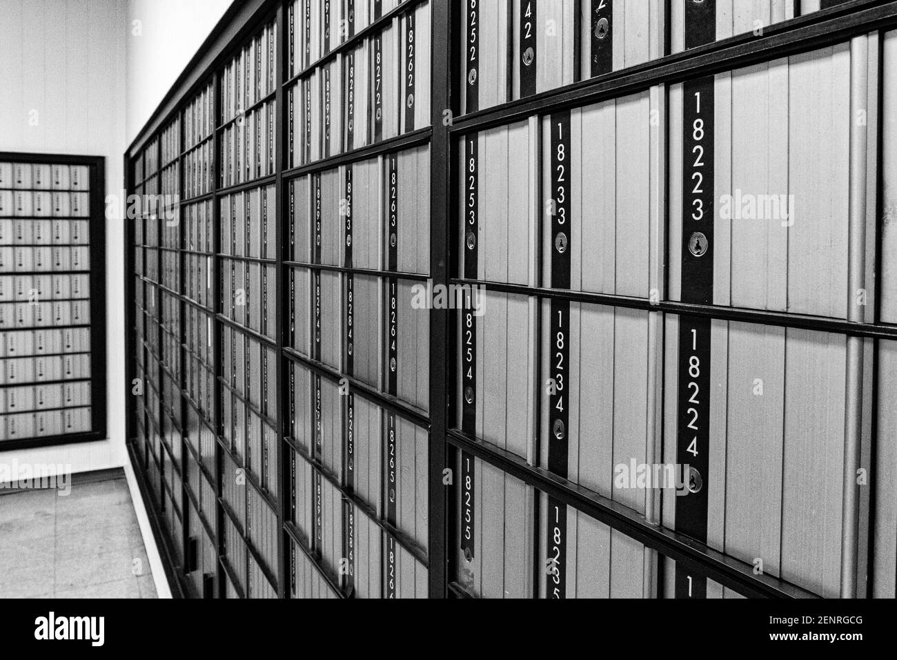 Post office boxes on a wall create a grid of lines at a branch of the ...