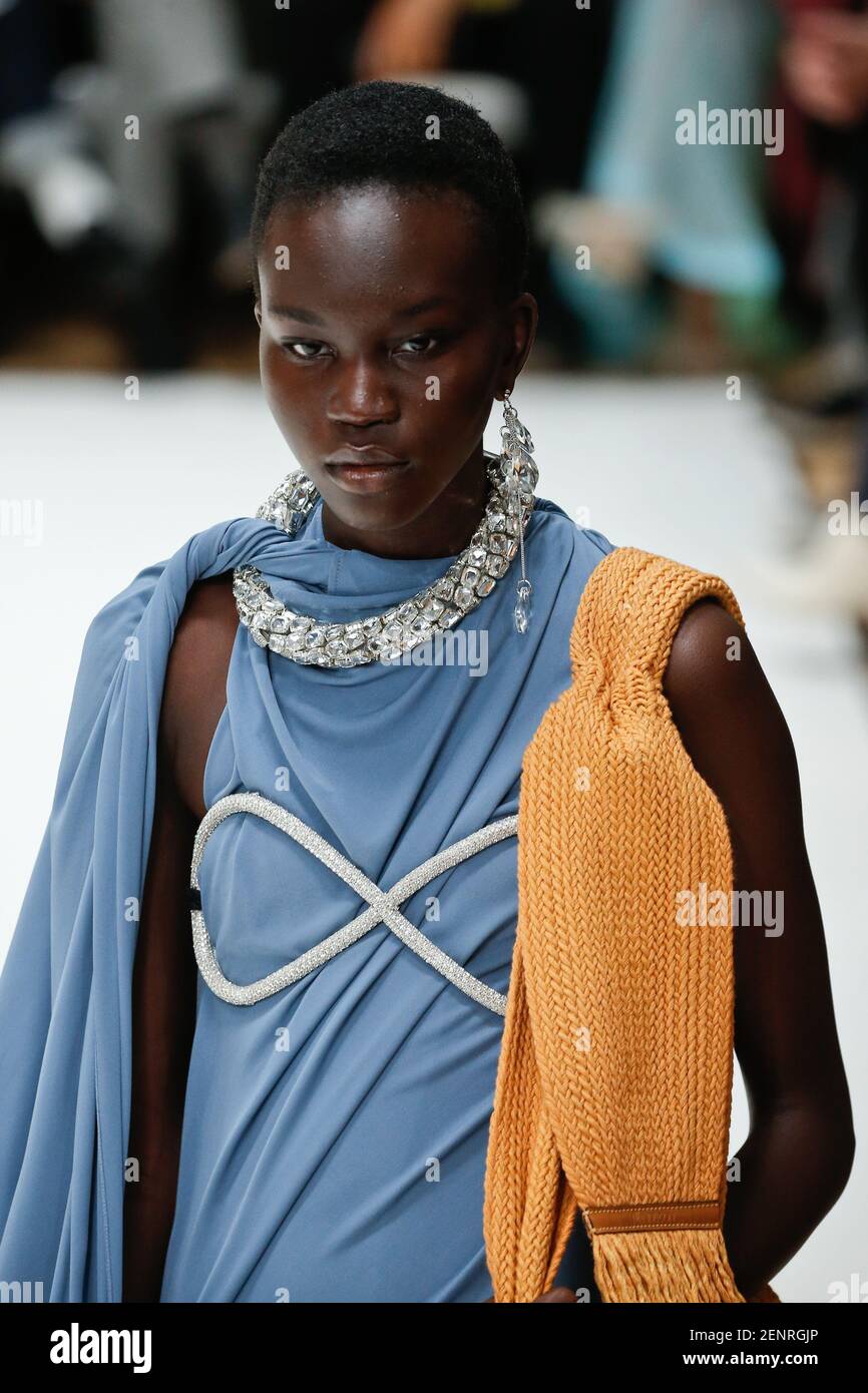 Achenrin Madit walking on the runway JW Anderson Fashion Show during ...