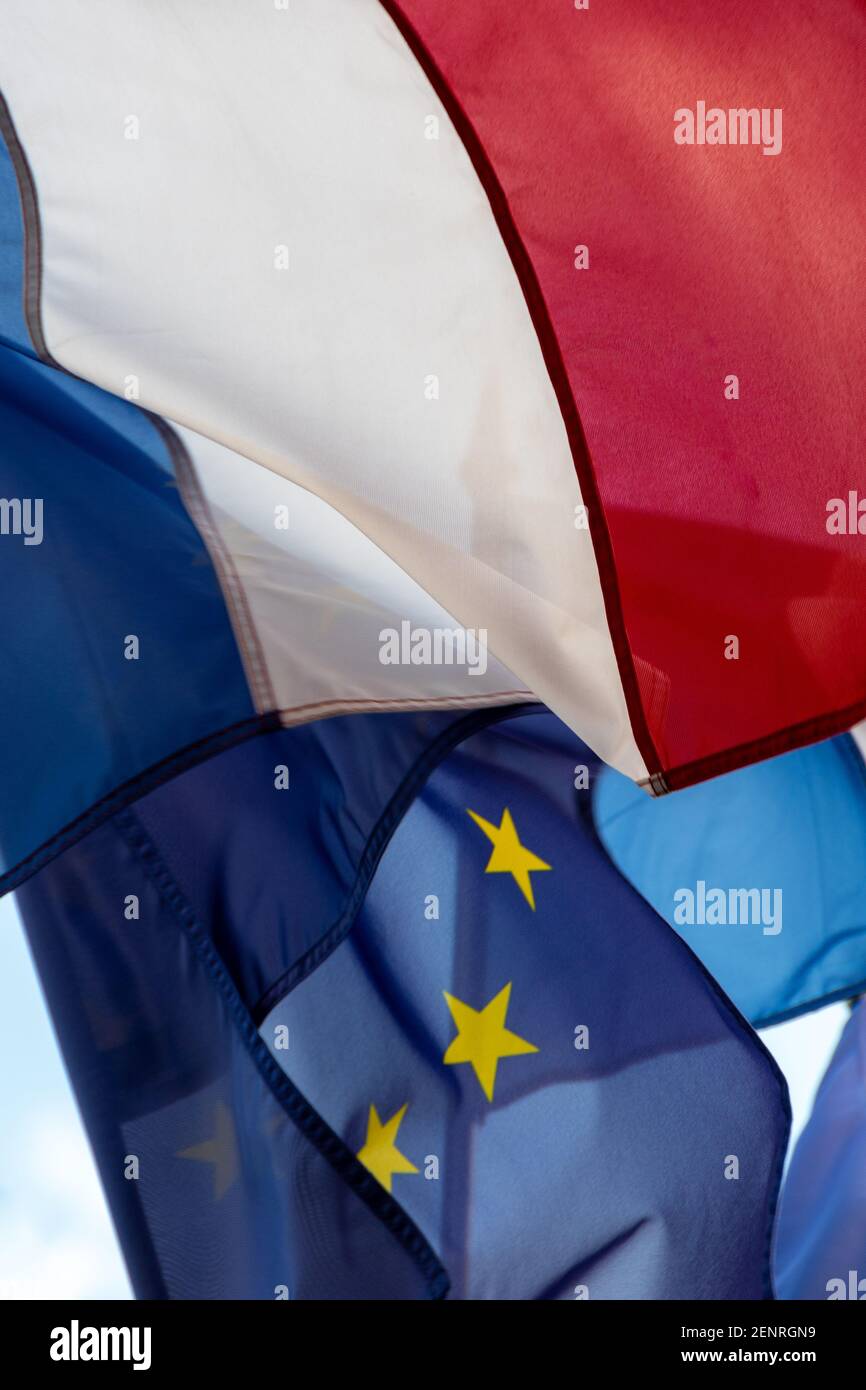 French and European Union flags fluttering together in the wind. Close ...