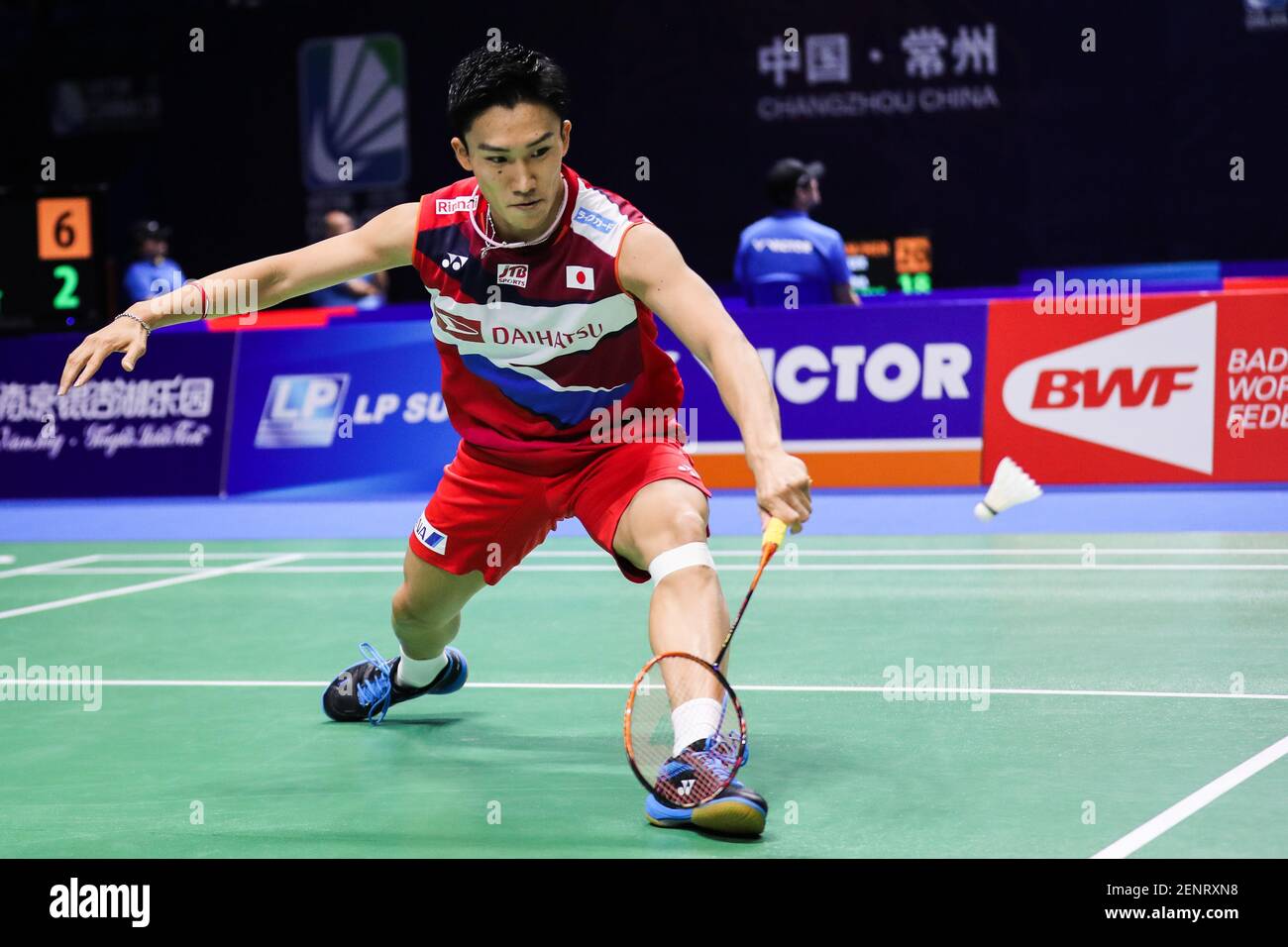 Japanese professional badminton player Kento Momota competes against ...