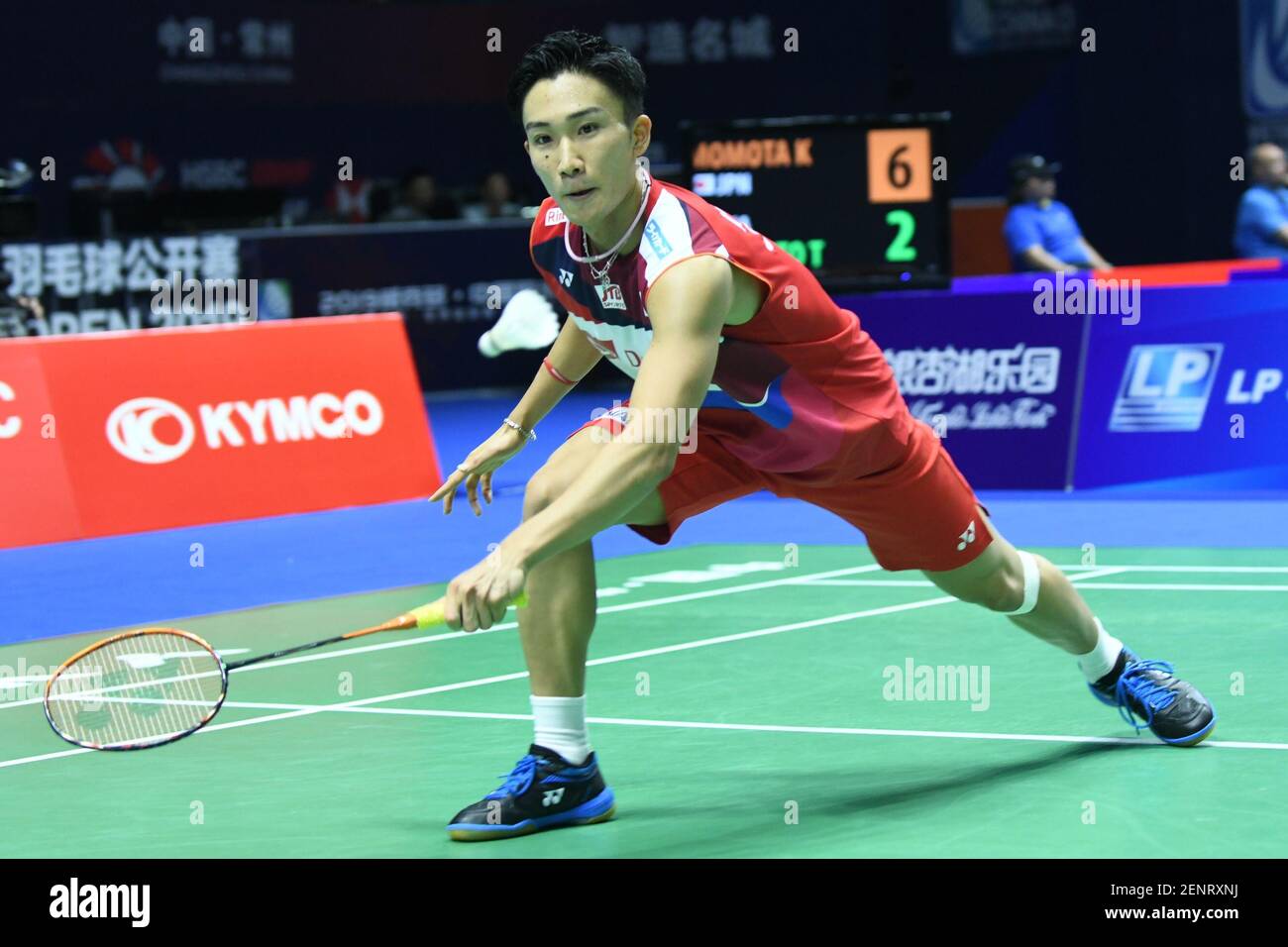 Japanese professional badminton player Kento Momota competes against ...