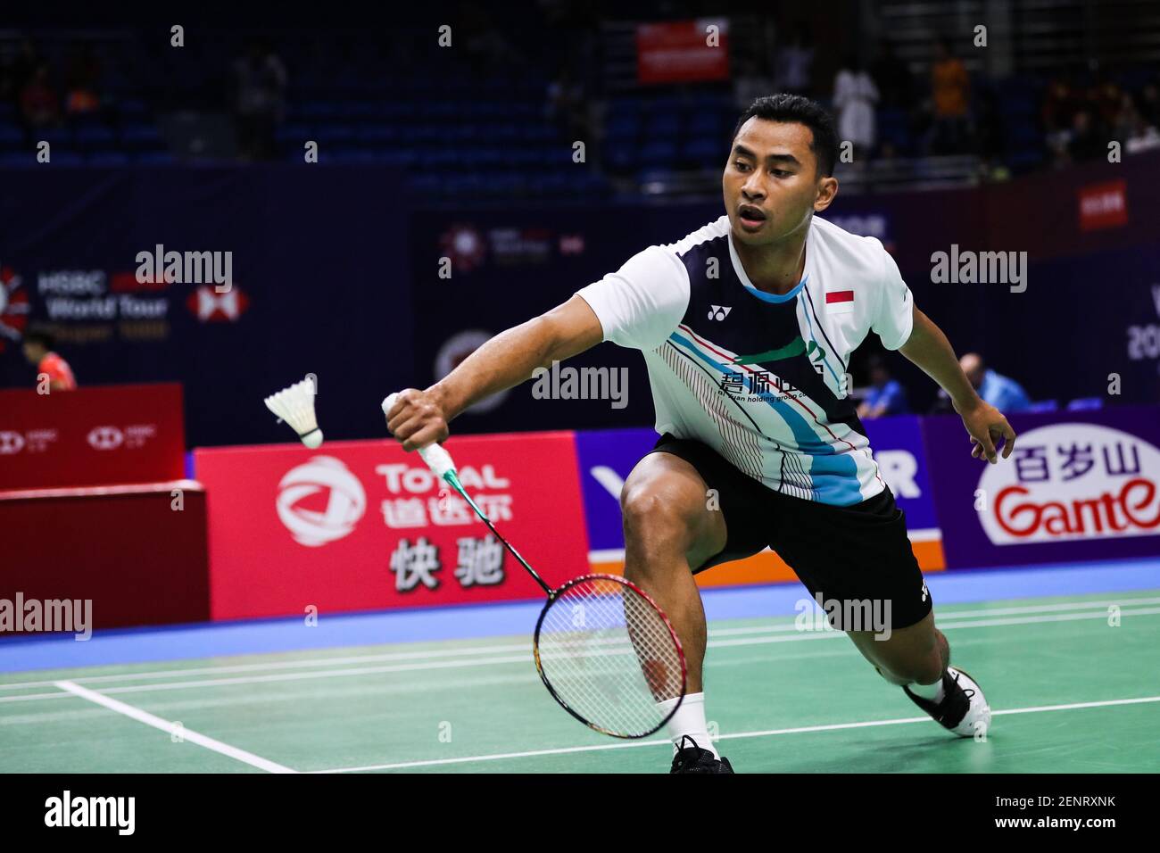 Indonesian professional badminton player Tommy Sugiarto competes ...