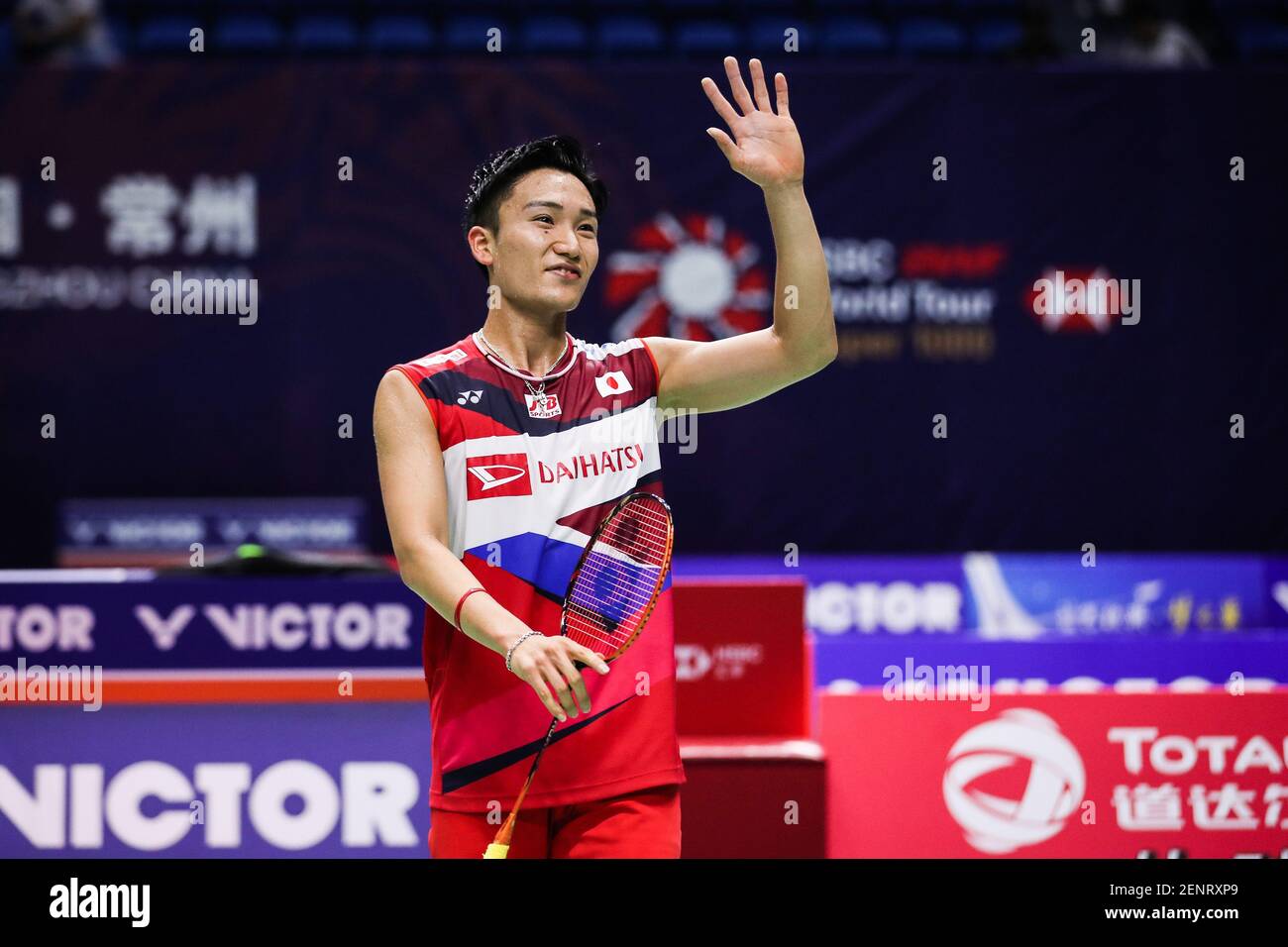 Japanese professional badminton player Kento Momota competes against ...