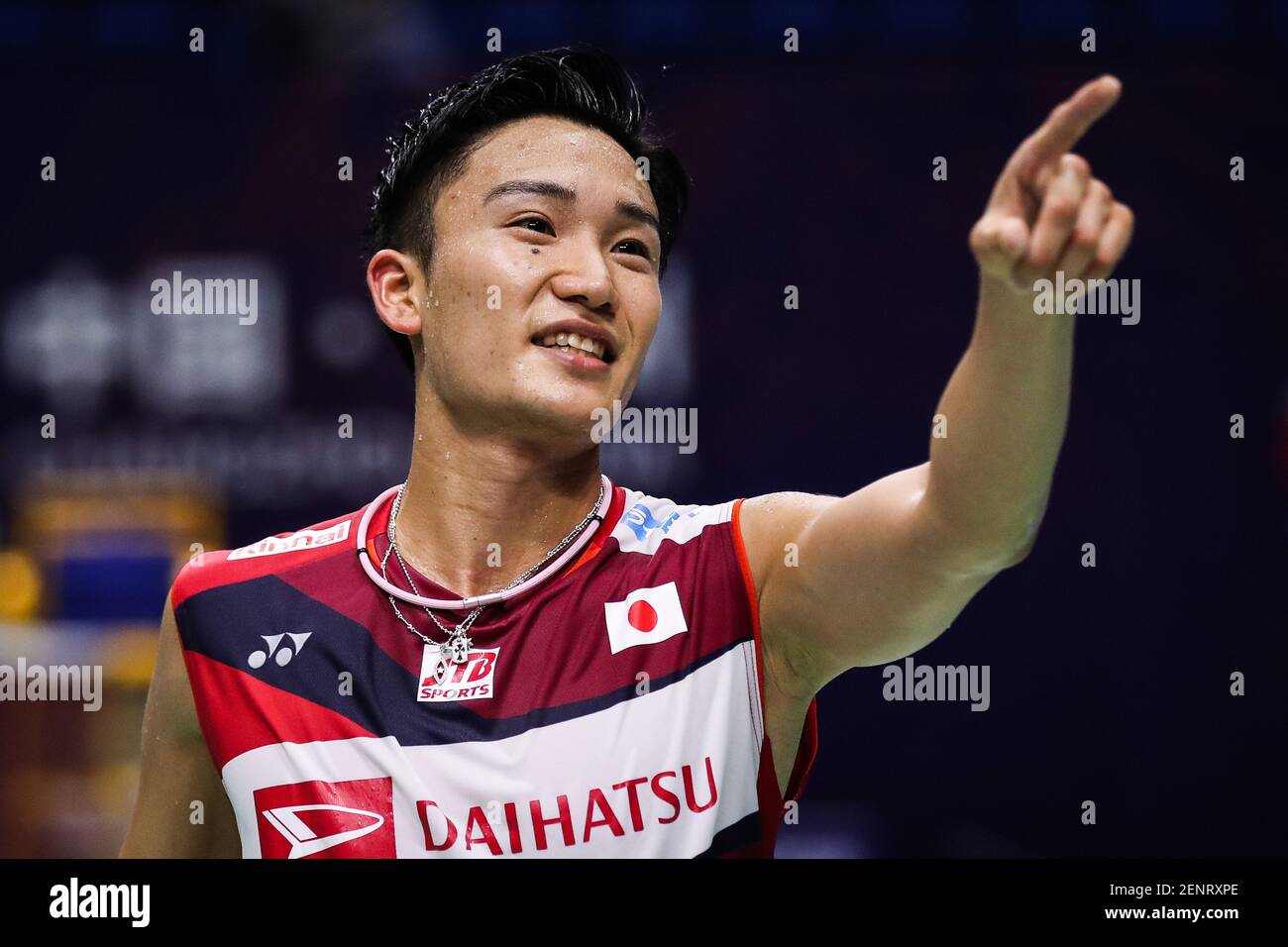 Japanese professional badminton player Kento Momota competes against ...