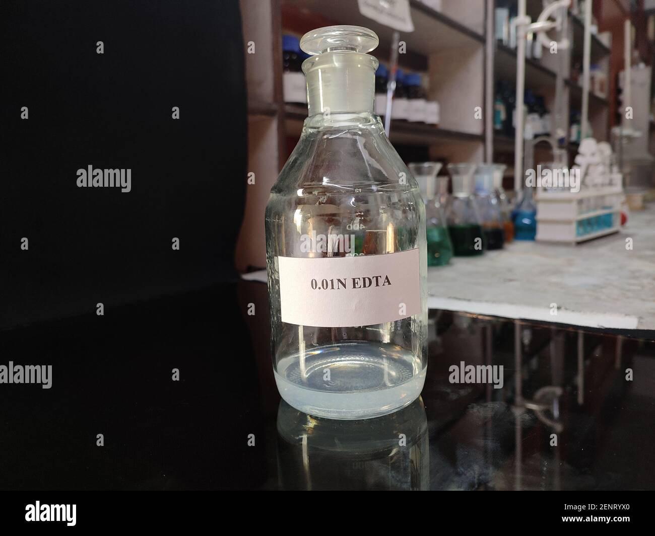 transparent bottle filled with reagent solution Stock Photo - Alamy