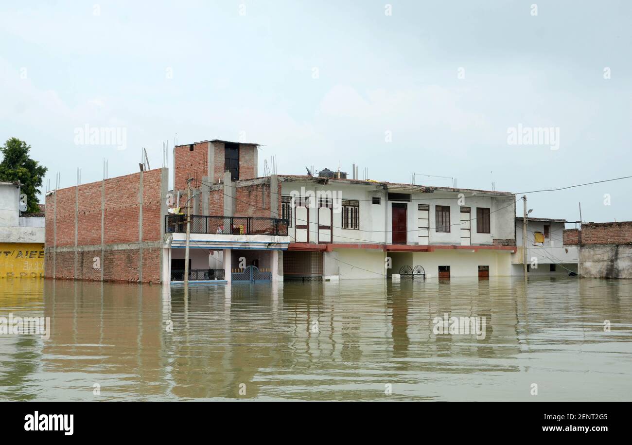 A view of houses submerged with flooded water of river Ganga at salori ...