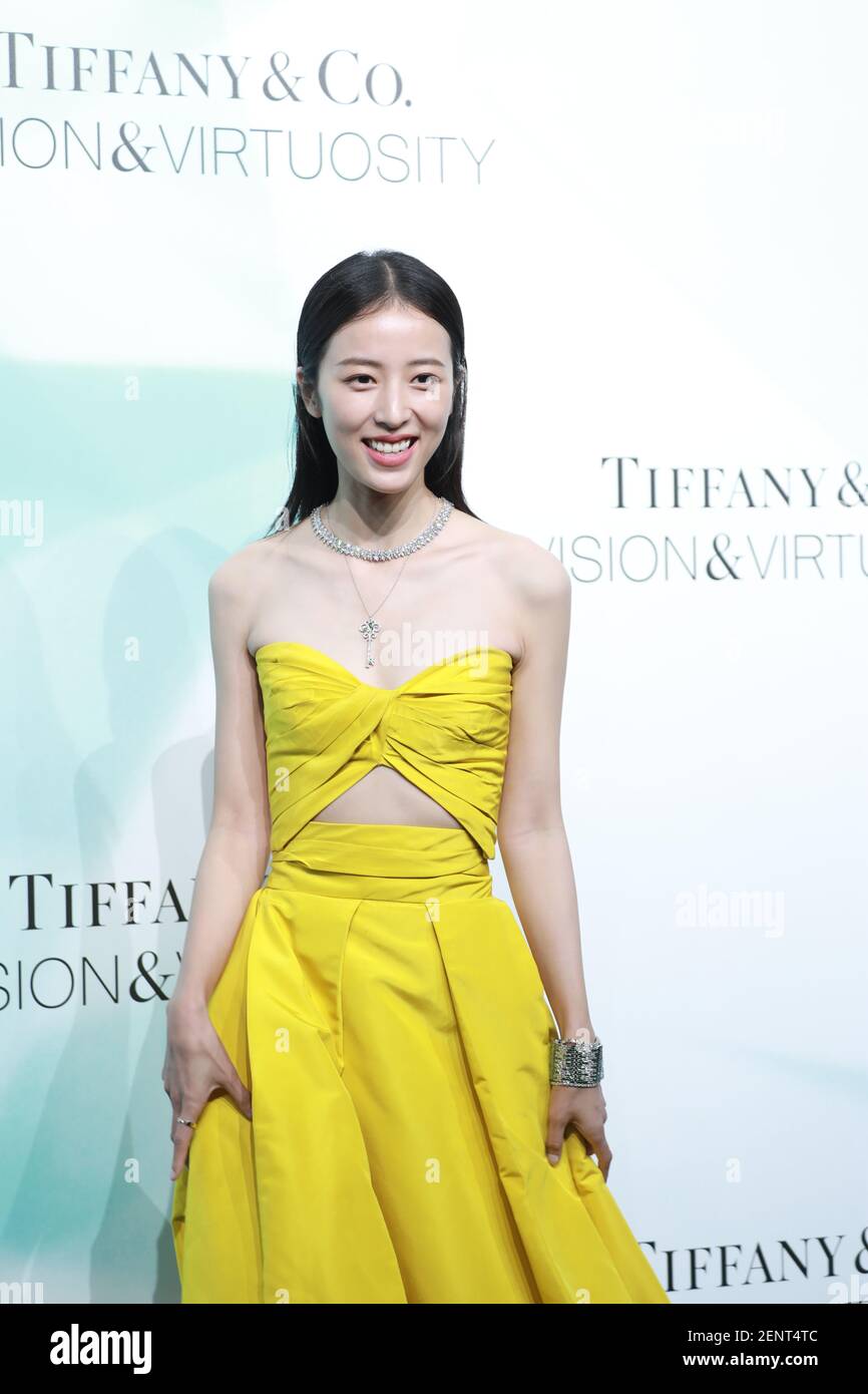 Chinese actress Zhou Yutong wears a bright yellow dress attending the ...