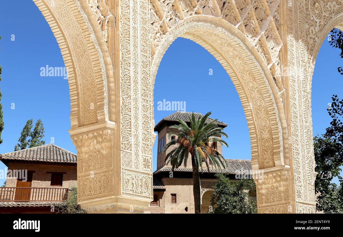 Arches in Islamic (Moorish) style and Alhambra, Granada, Spain Stock ...