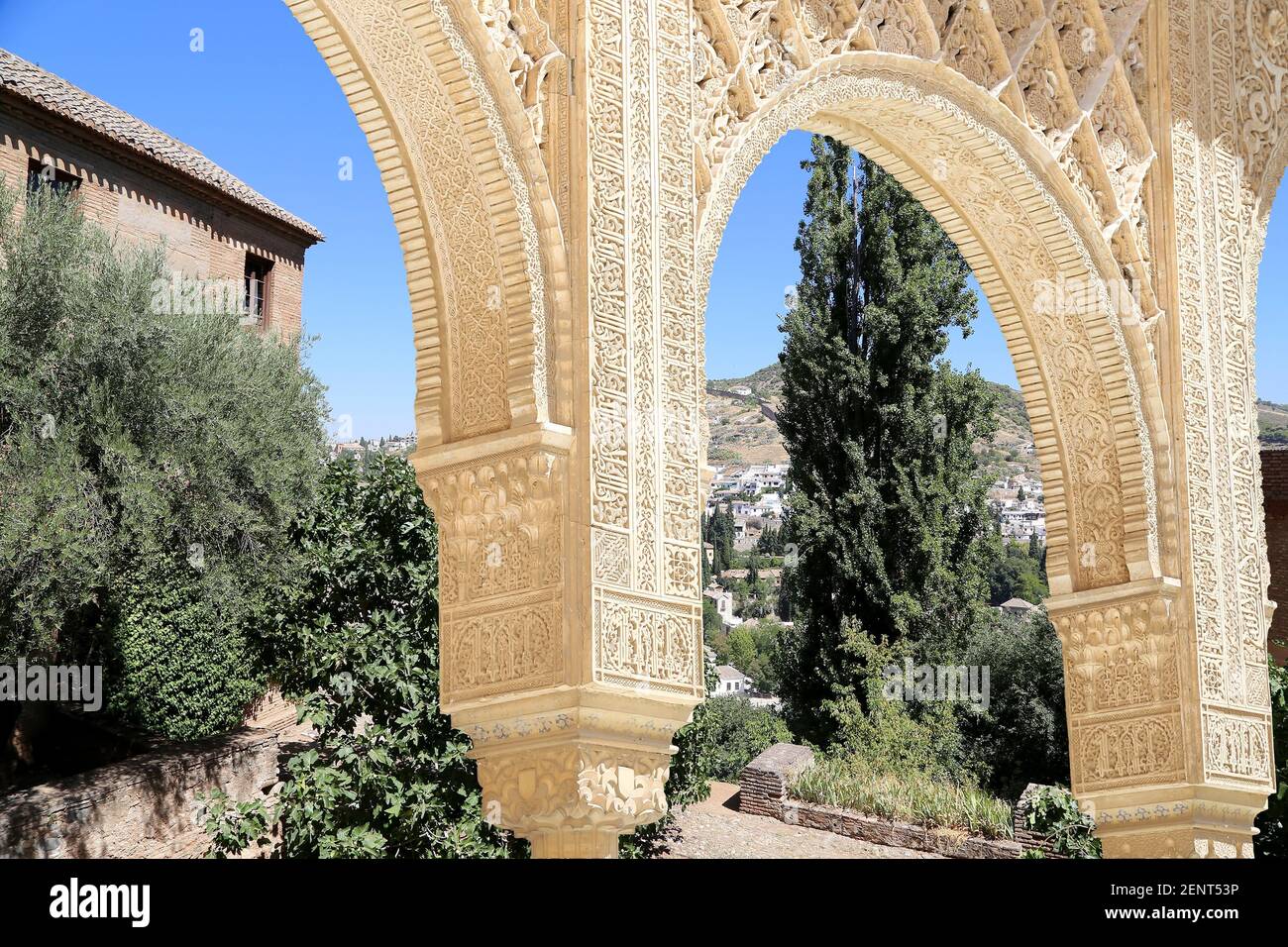 Arches in Islamic (Moorish) style and Alhambra, Granada, Spain Stock ...