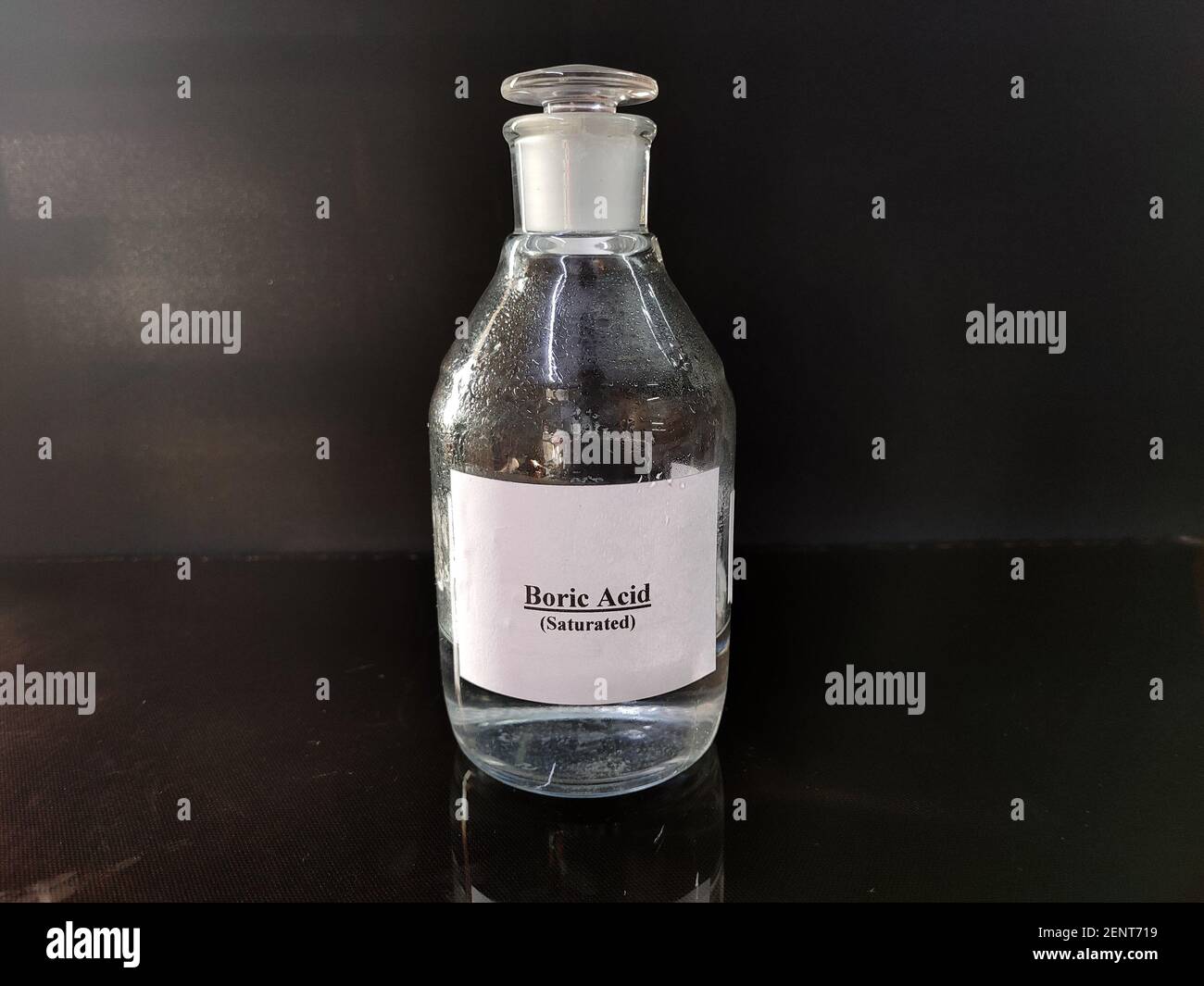 transparent bottle filled with reagent solution Stock Photo - Alamy