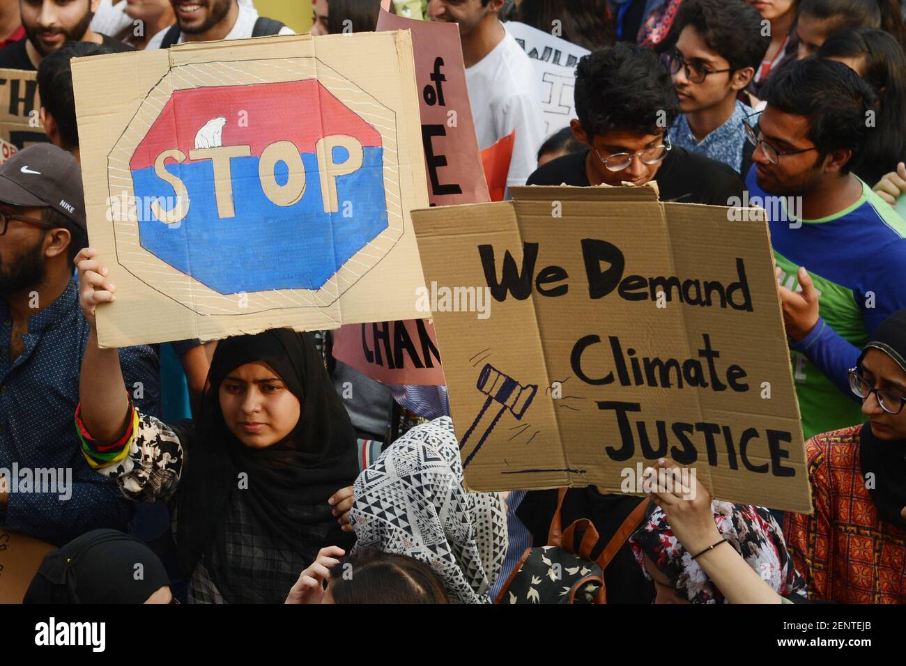 People mostly students hold placards as they march for a Global Climate ...