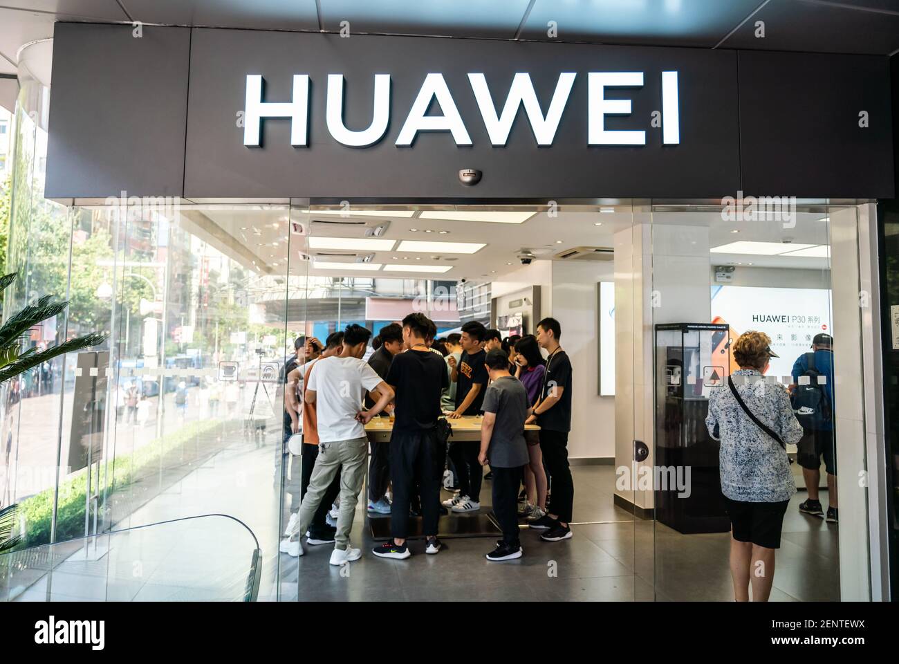 Customers at a Huawei retail store on East Nanjing Road in Shanghai ...