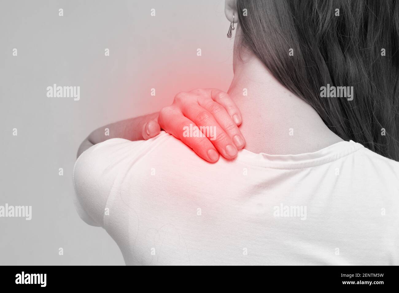 The person feels pain in the shoulder girdle and neck Stock Photo - Alamy