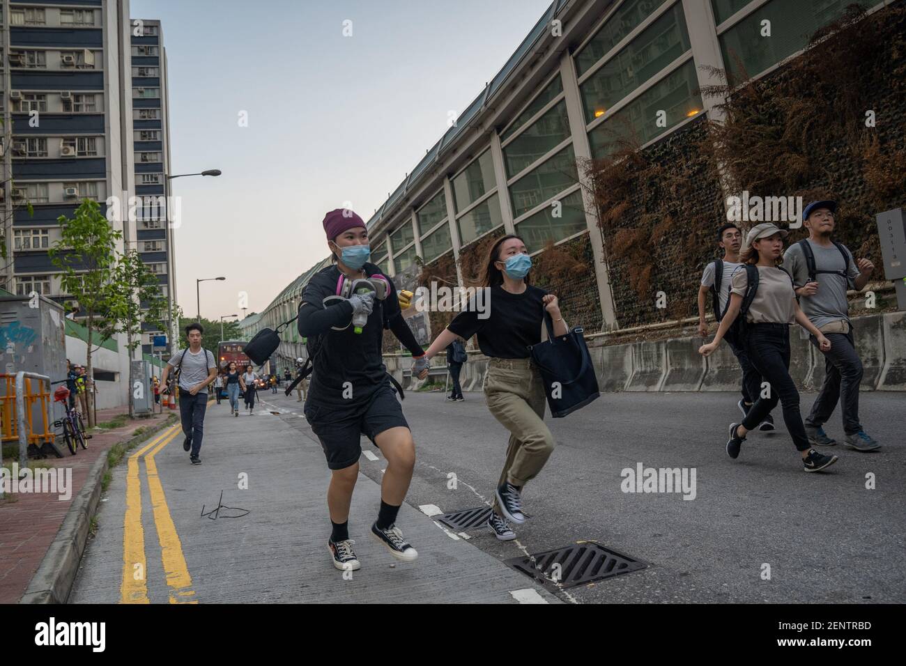 Protesters running away from their original position as riot police ...