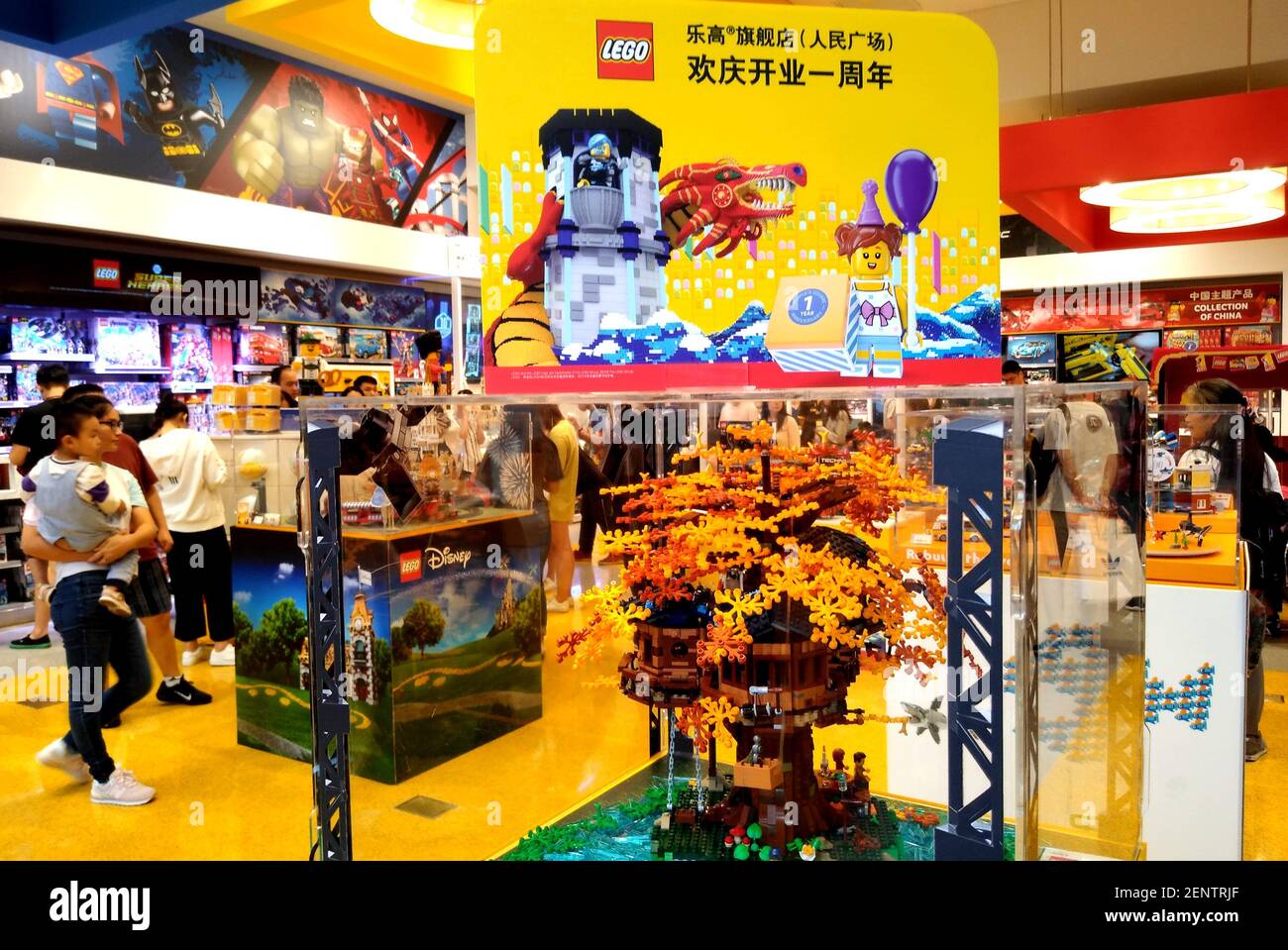 Consumers stroll and observe new LEGO models exhibited as the first ...