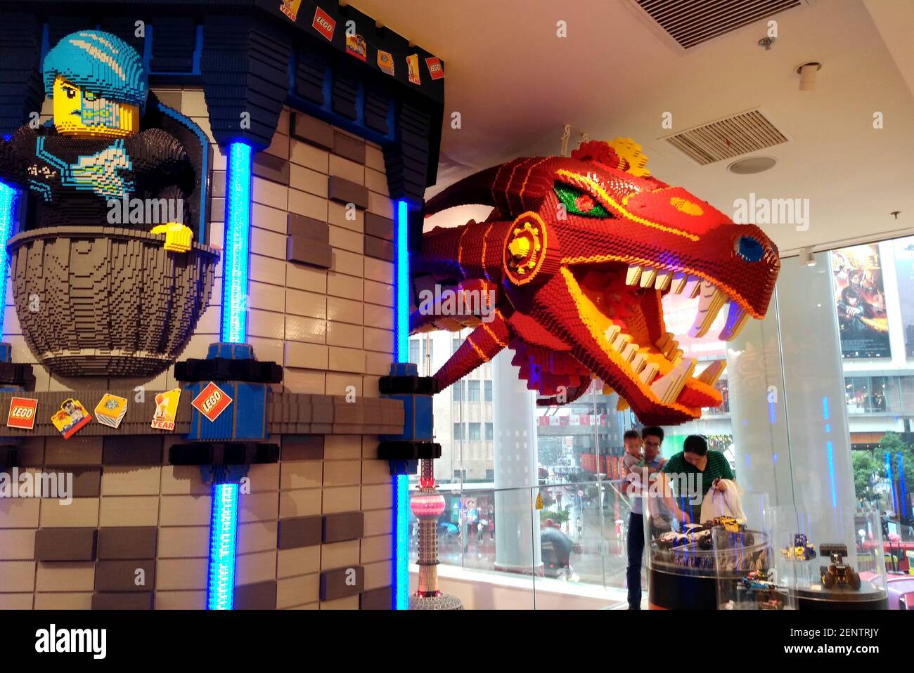 Consumers stroll and observe new LEGO models exhibited as the first ...