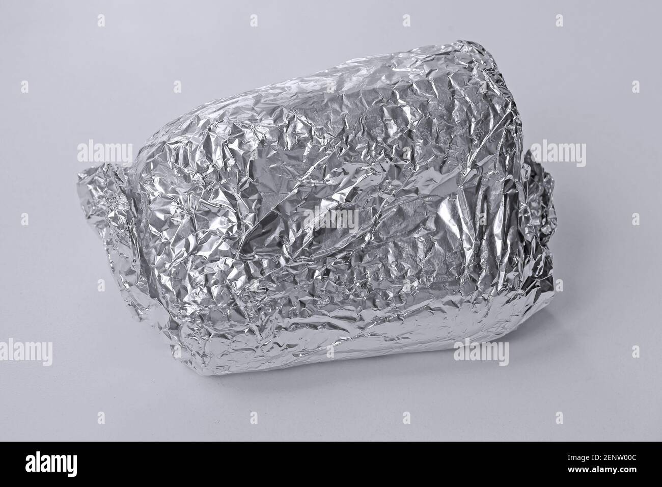 Sandwich wrapped up in silver aluminum foil isolated on white ...