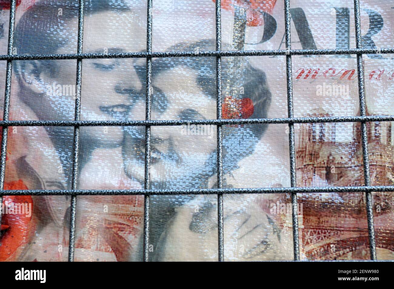 Poster of a couple behind grid, Paris, Île-de-France, France Stock ...