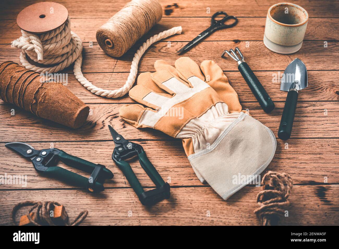 Gardening tools and equipment on wooden background Stock Photo - Alamy