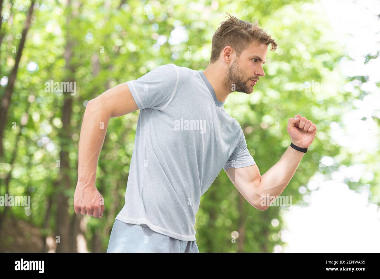 Sport is way of life. Sportsman lifestyle. Handsome athlete in park ...