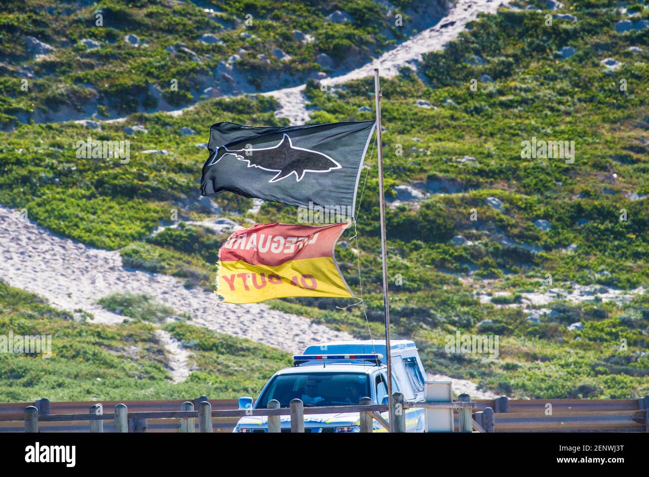 Shark flag during a visit to Waves for Change (W4C) on Monwibisi Beach ...