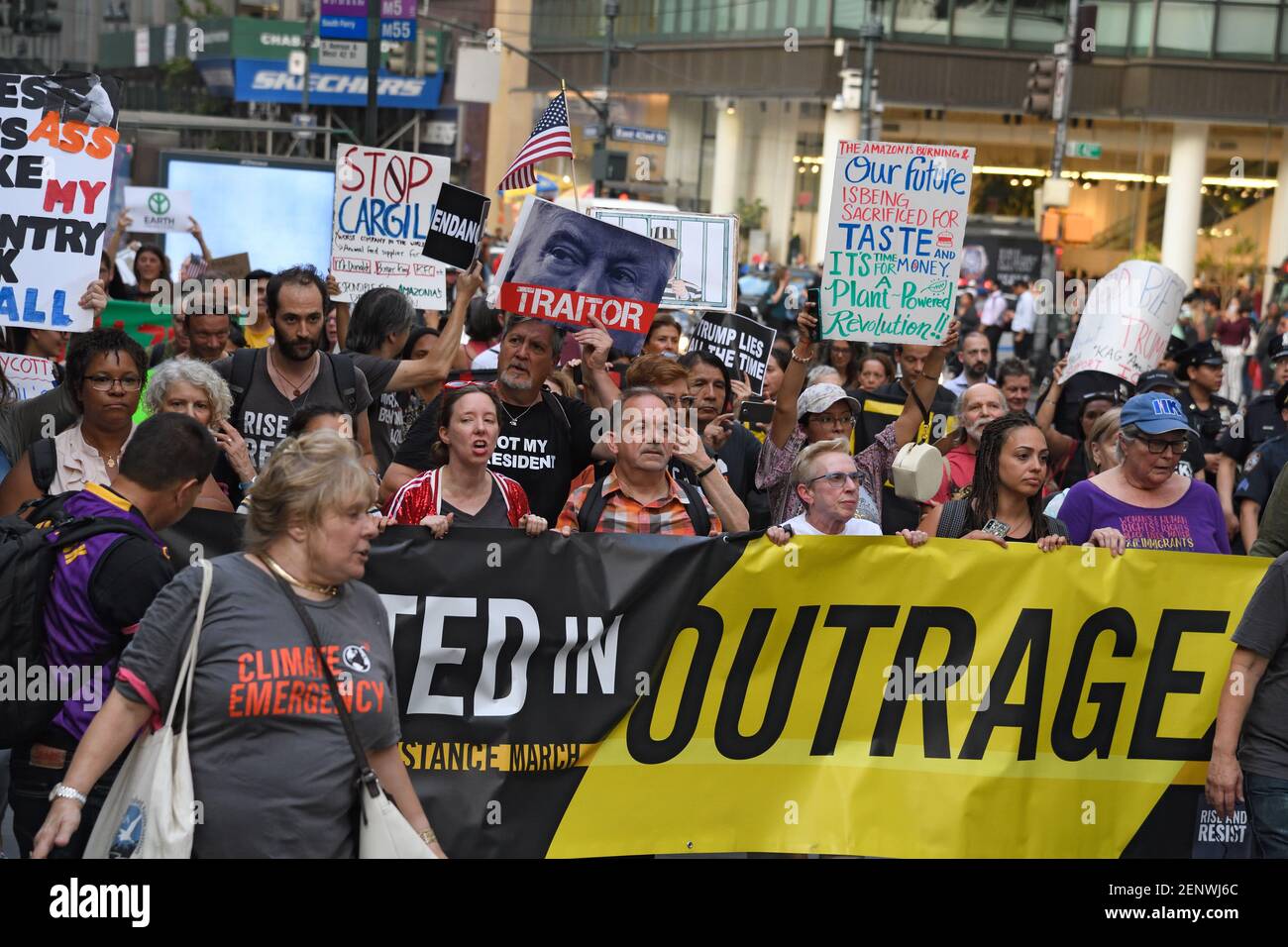 Protesters holding placards and a huge banner during the Rise and ...