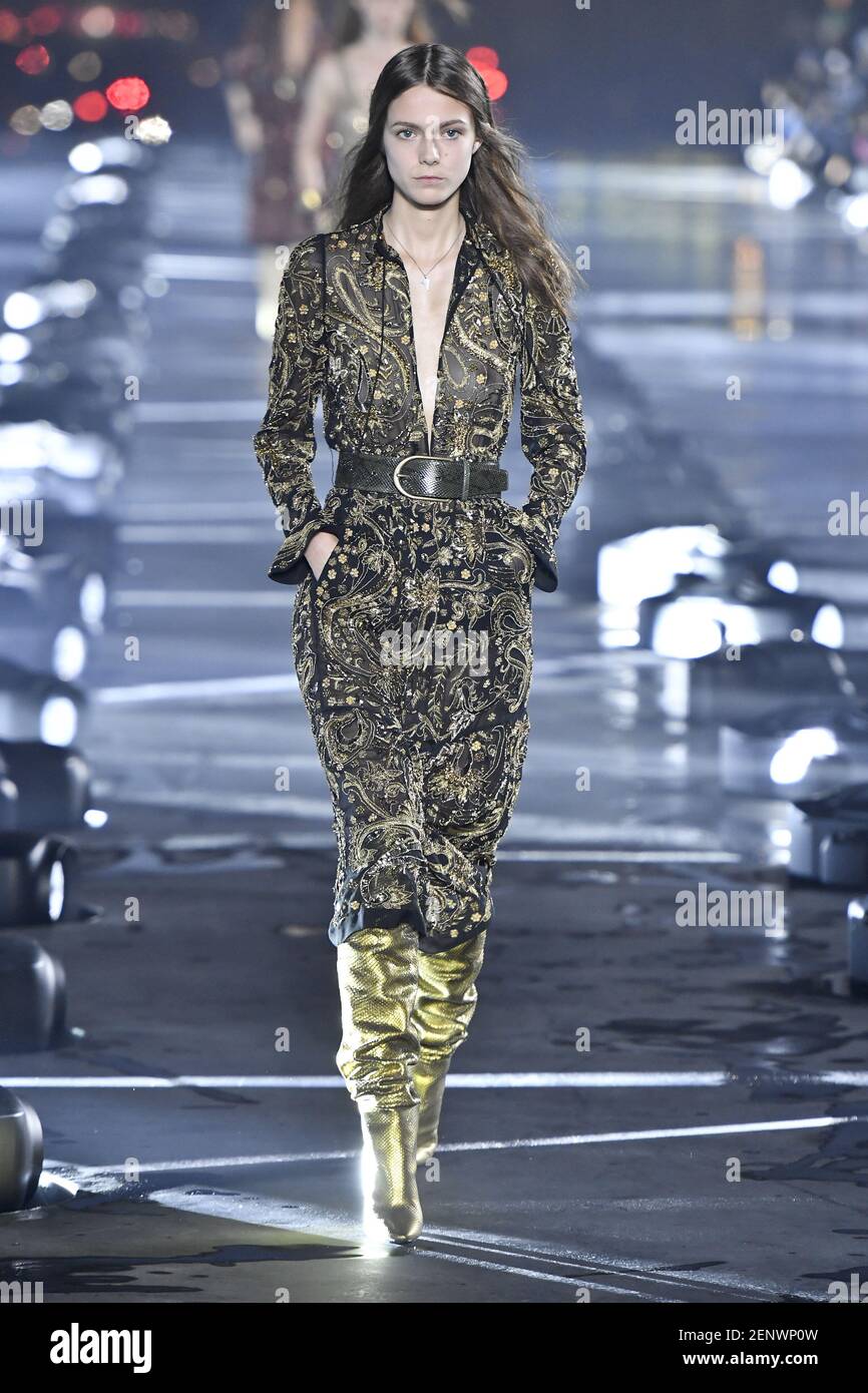 Model walking on the runway during the Yves Saint Laurent Ready to Wear ...