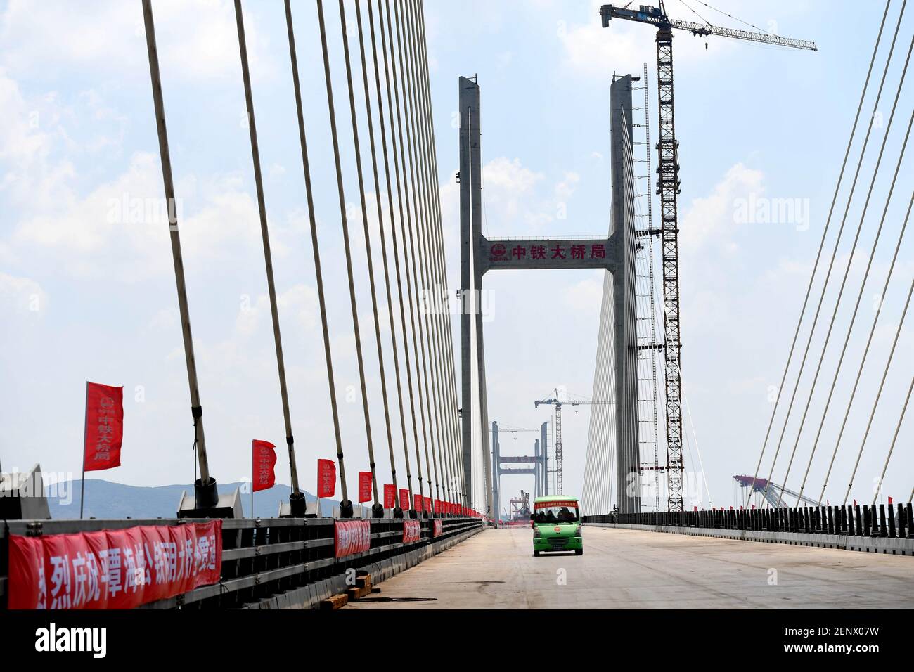 Chinese workers labor at the Pingtan Strait Road-rail Bridge, the world ...