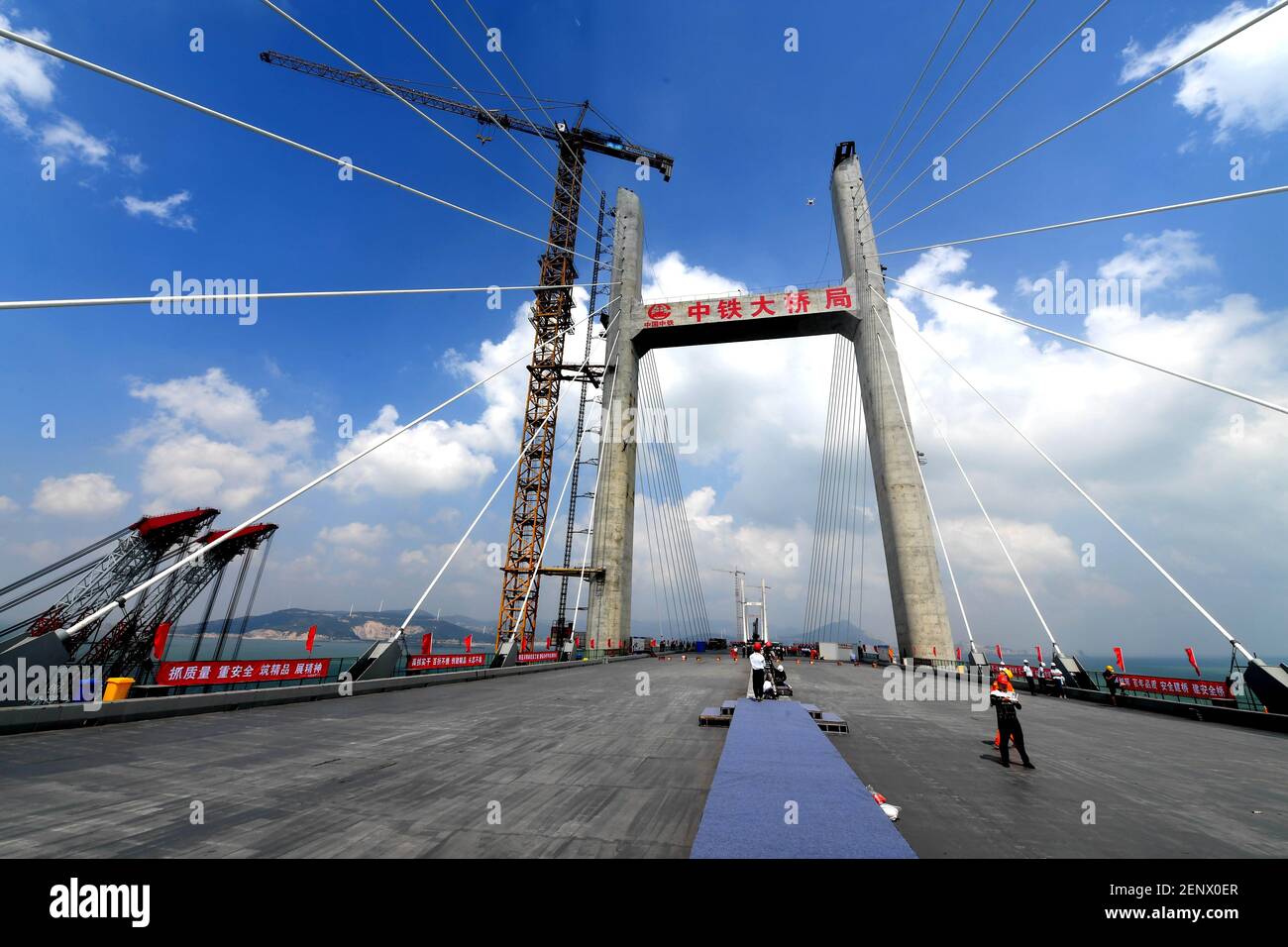 Chinese workers labor at the Pingtan Strait Road-rail Bridge, the world ...