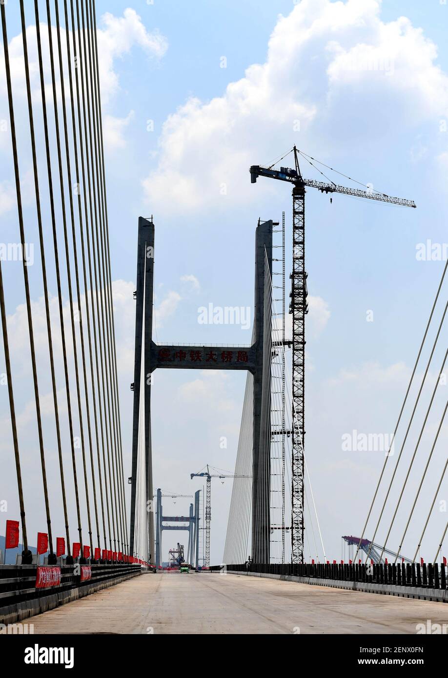 Chinese workers labor at the Pingtan Strait Road-rail Bridge, the world ...