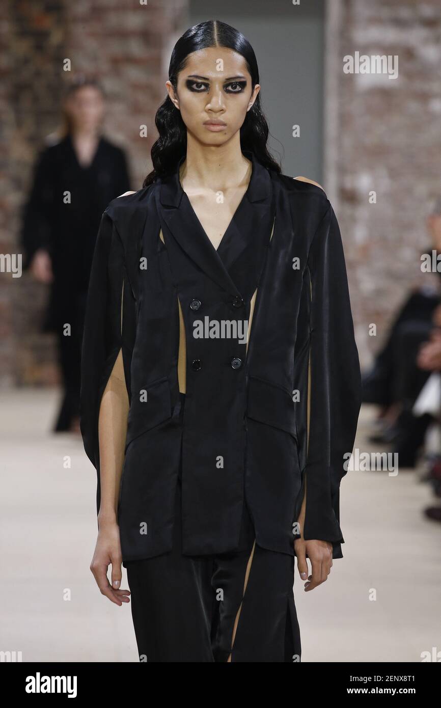 Model Noah Carlos walking on the runway during the Ann Demeulemeester ...