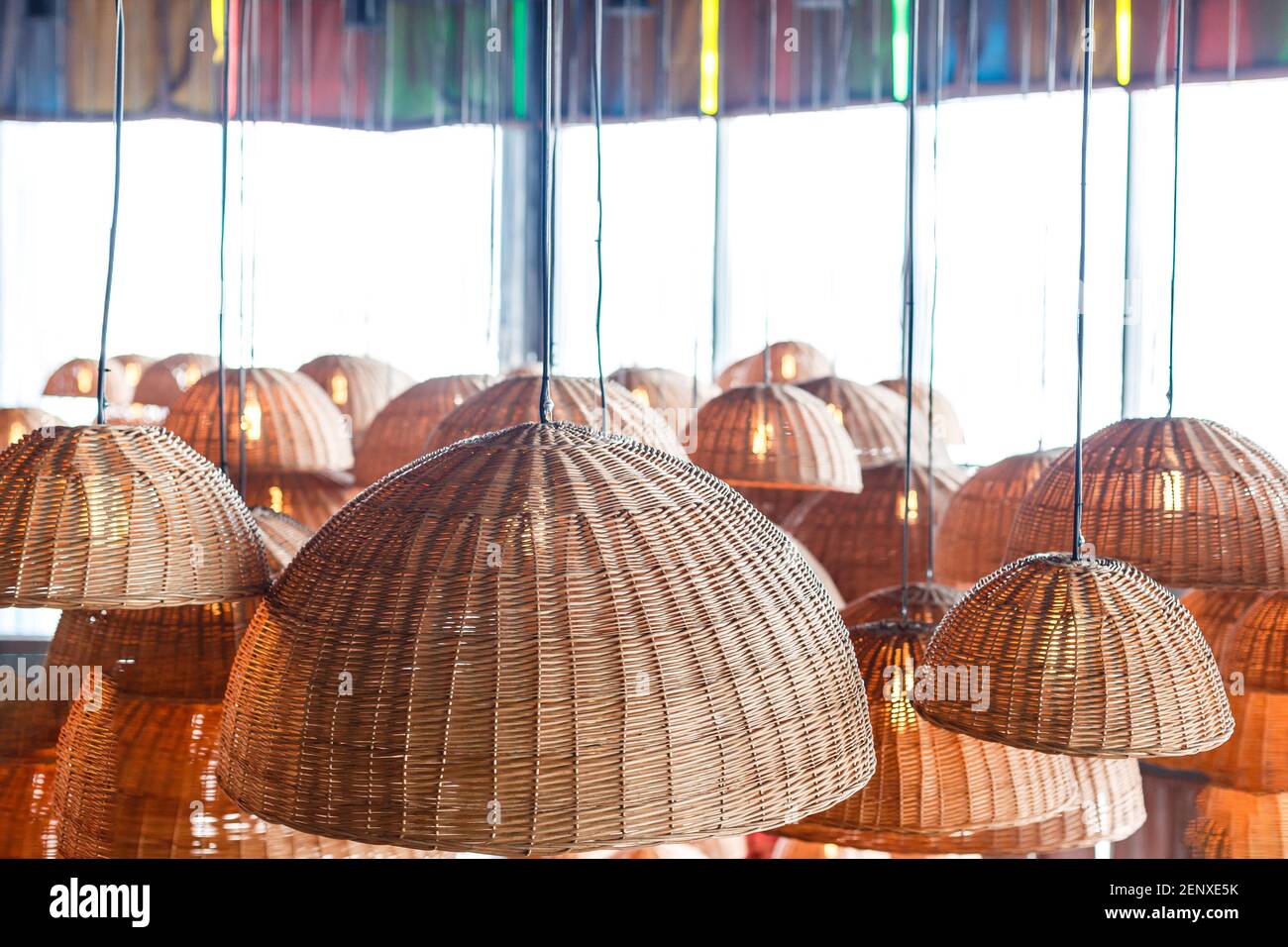lamps in straw shades on the ceiling for decoration Stock Photo - Alamy