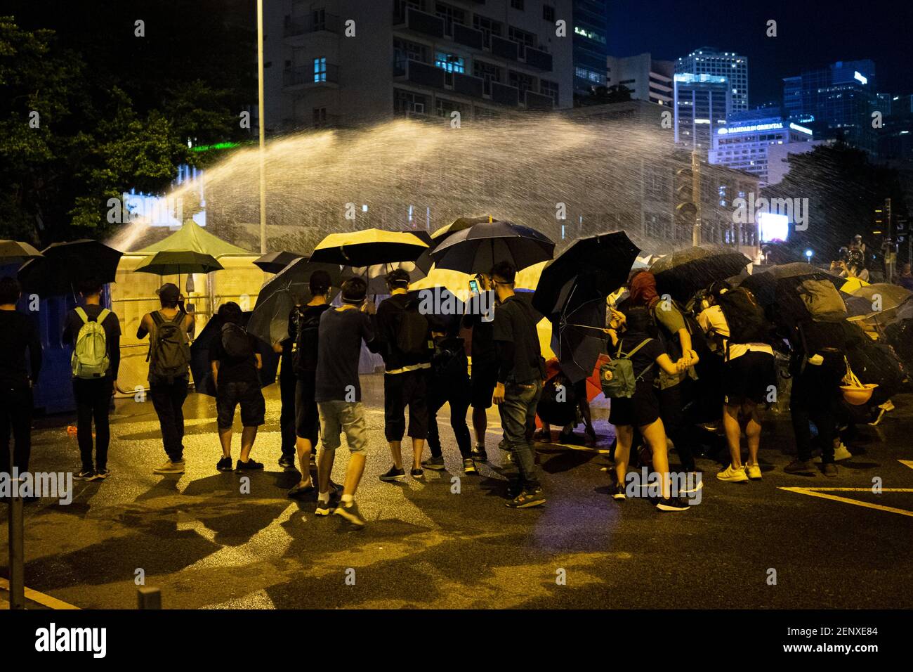 Admiralty, Hong Kong: Riot police douse a crowd of protestors with a ...