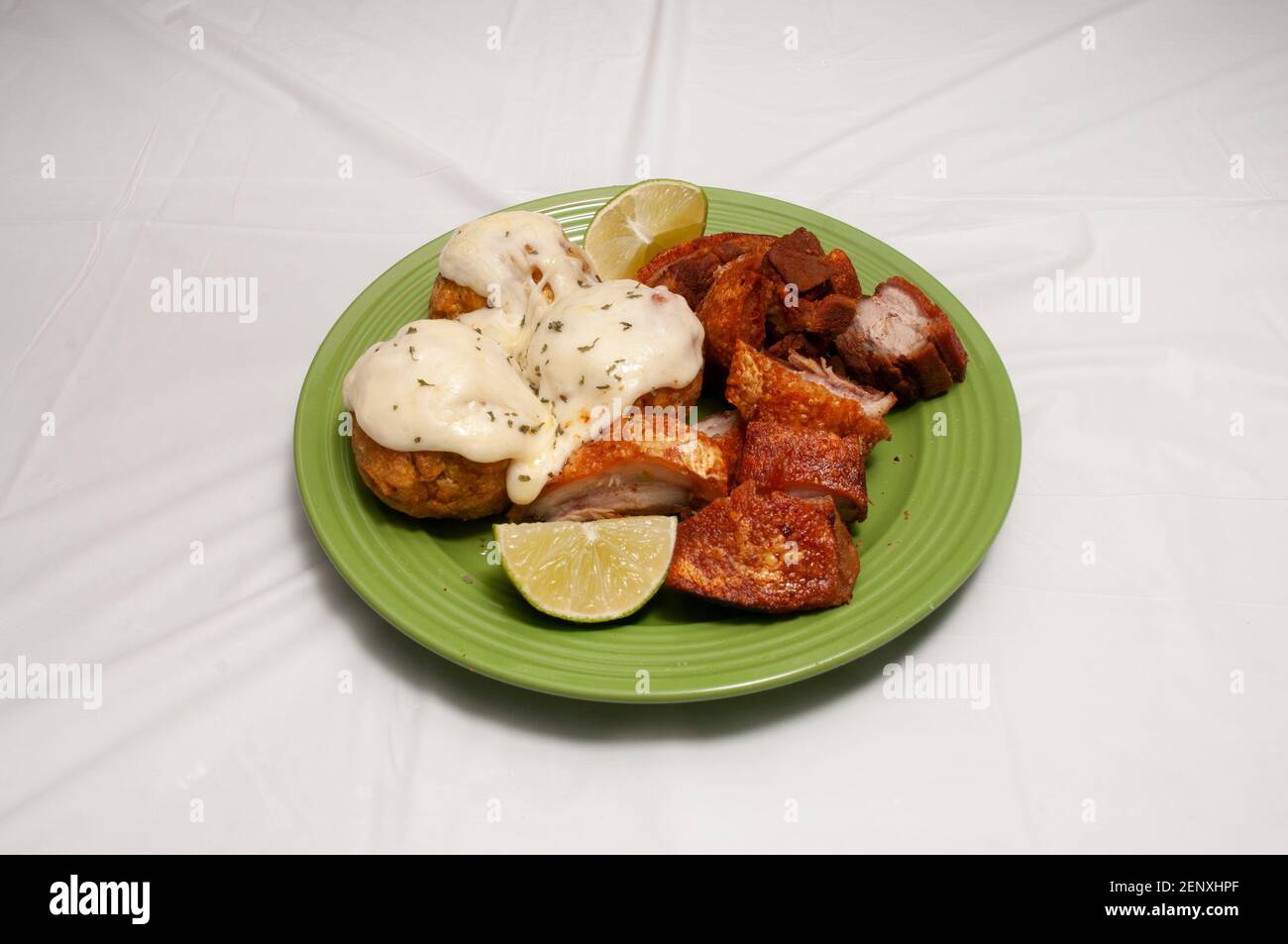 traditional mofongo with fried pork belly chunks Stock Photo - Alamy