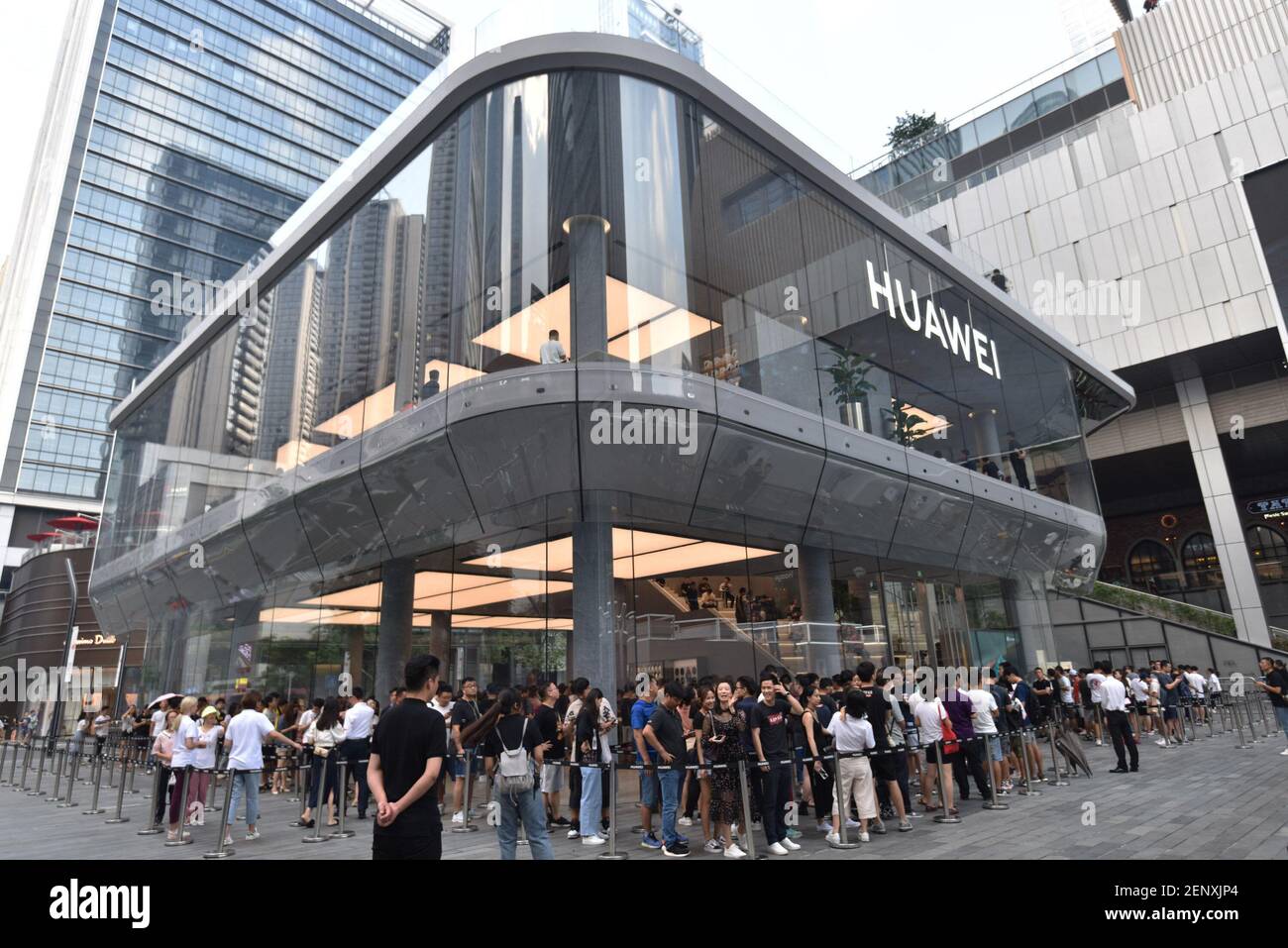 Consumers flock to get inside and experience the first Huawei's global ...