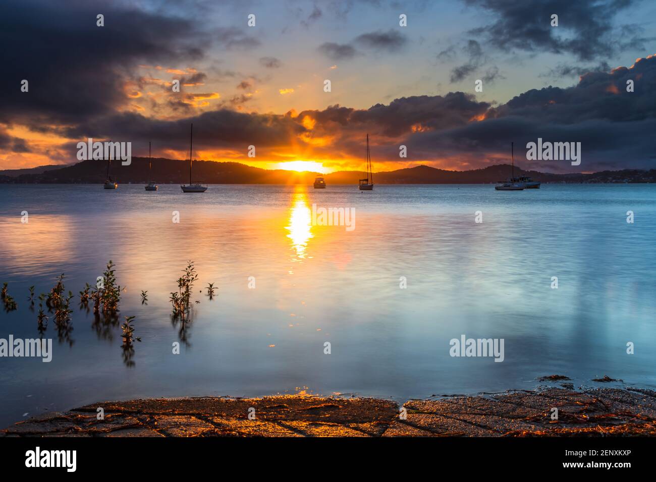 Drizzly day waterscape sunrise with boats from Koolewong Waterfront on ...